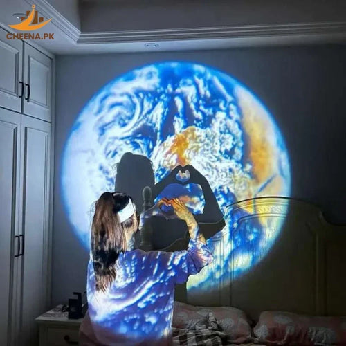 Woman forming heart hands in front of Earth projection on bedroom wall ...