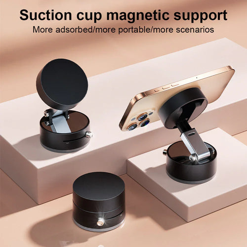 Black suction cup magnetic phone stand holding a gold smartphone, shown ...